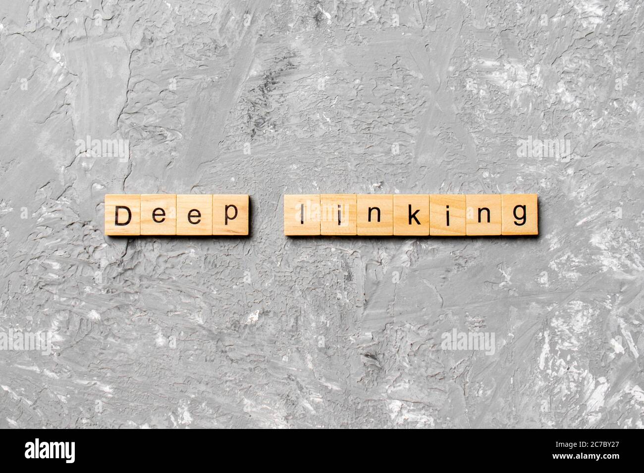 Deep Linking word written on wood block. Deep Linking text on cement ...