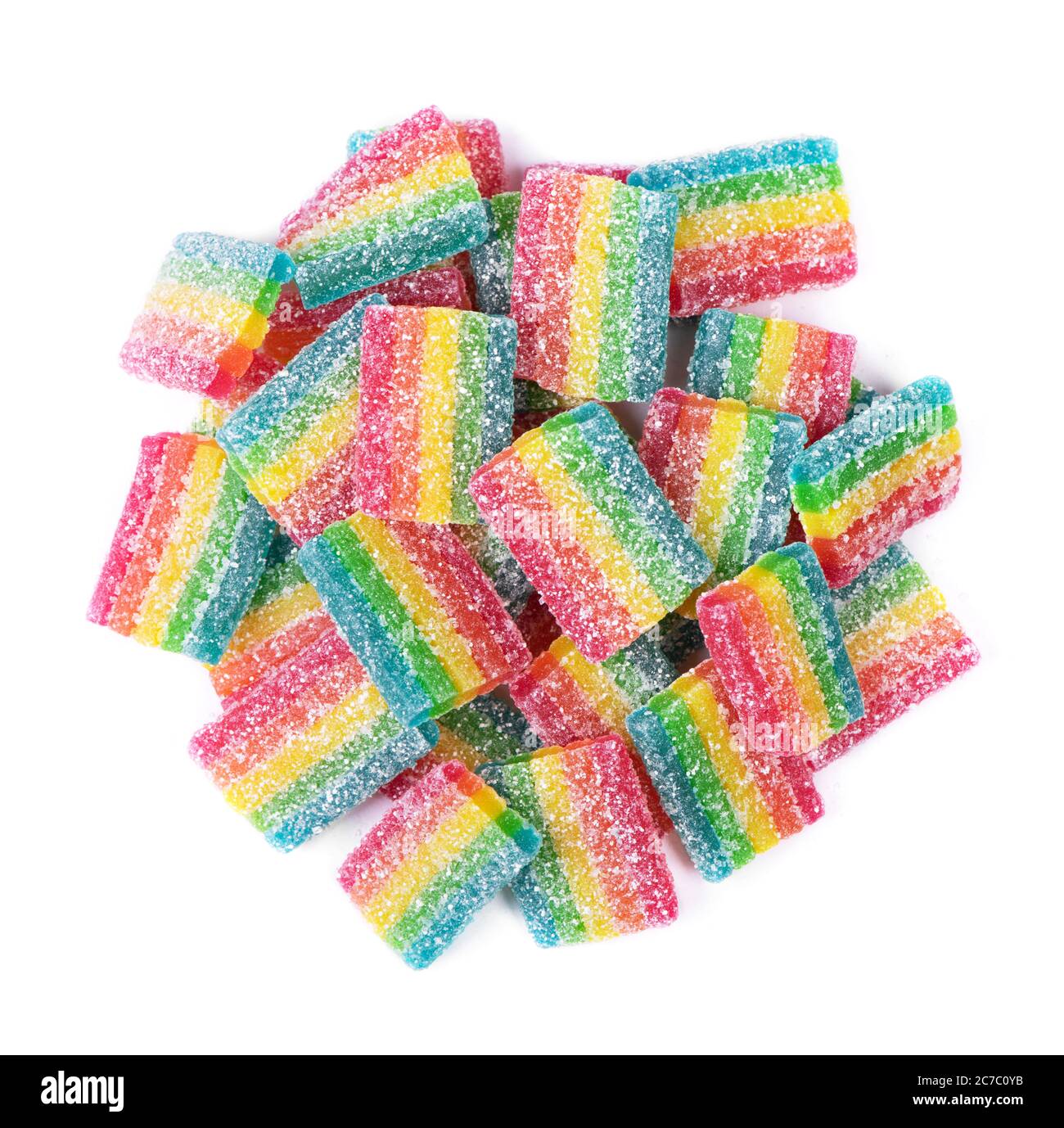 Heap of rainbow marmalade with sugar isolated over white background ...