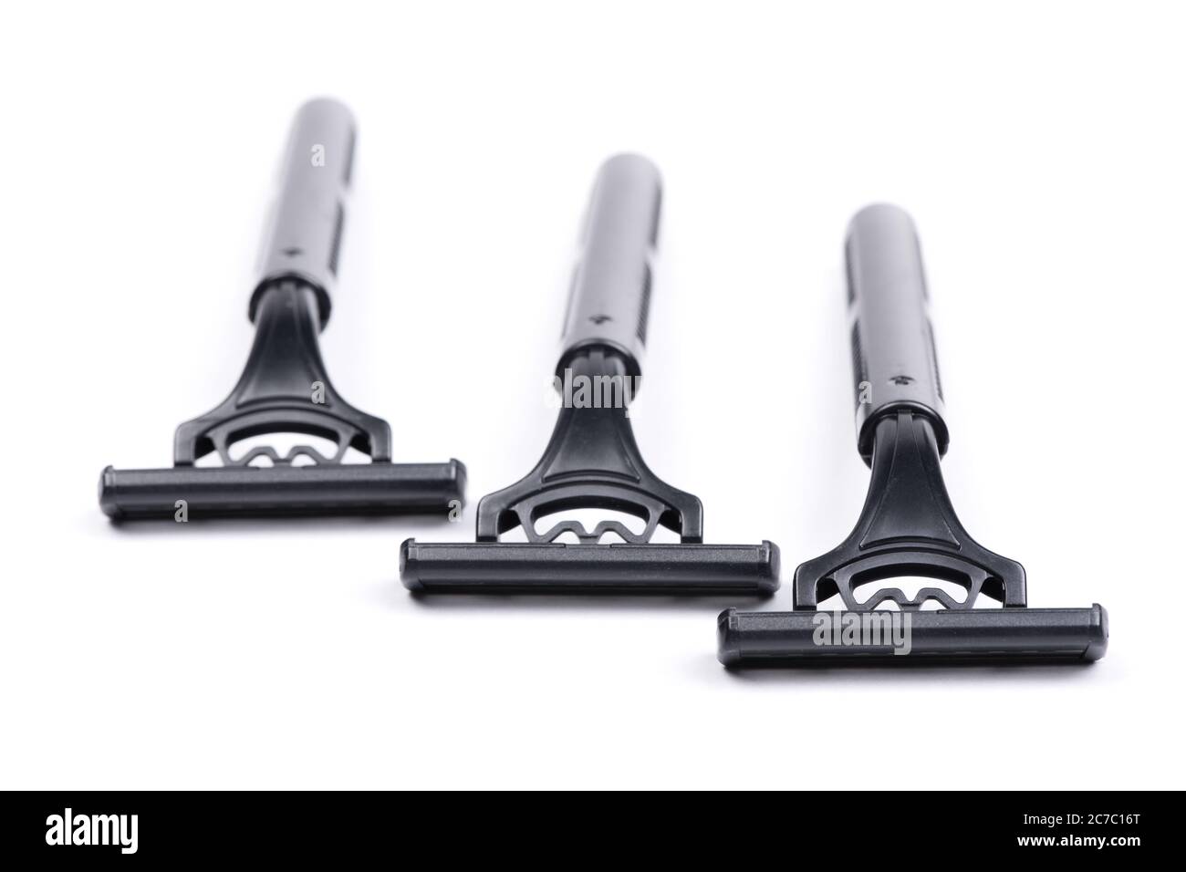Group of new black plastic disposable shavers isolated on white ...