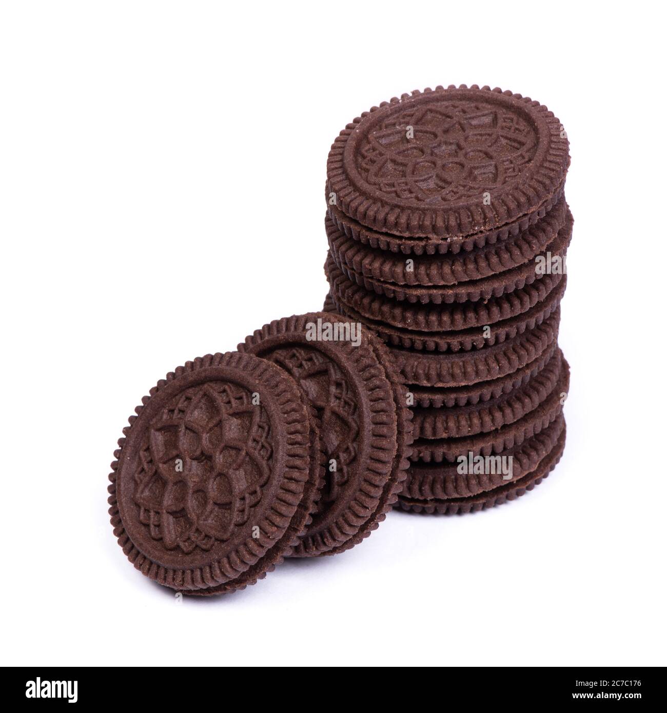 Heap of double chocolate cookies with filling isolated on white ...