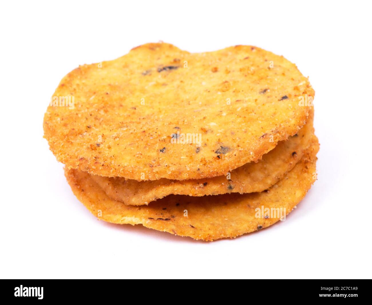 Heap of round nachos isolated on white background Stock Photo - Alamy