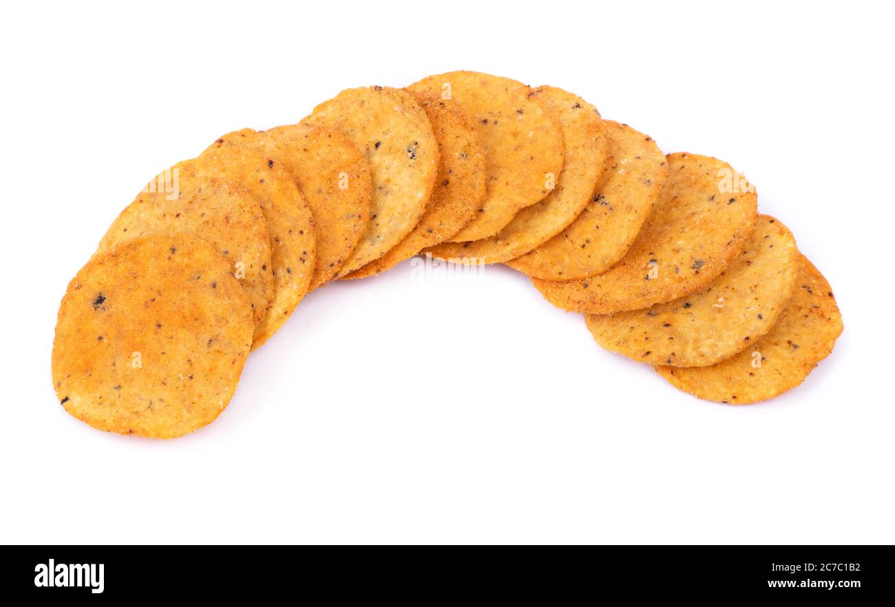Heap of round nachos isolated on white background Stock Photo - Alamy