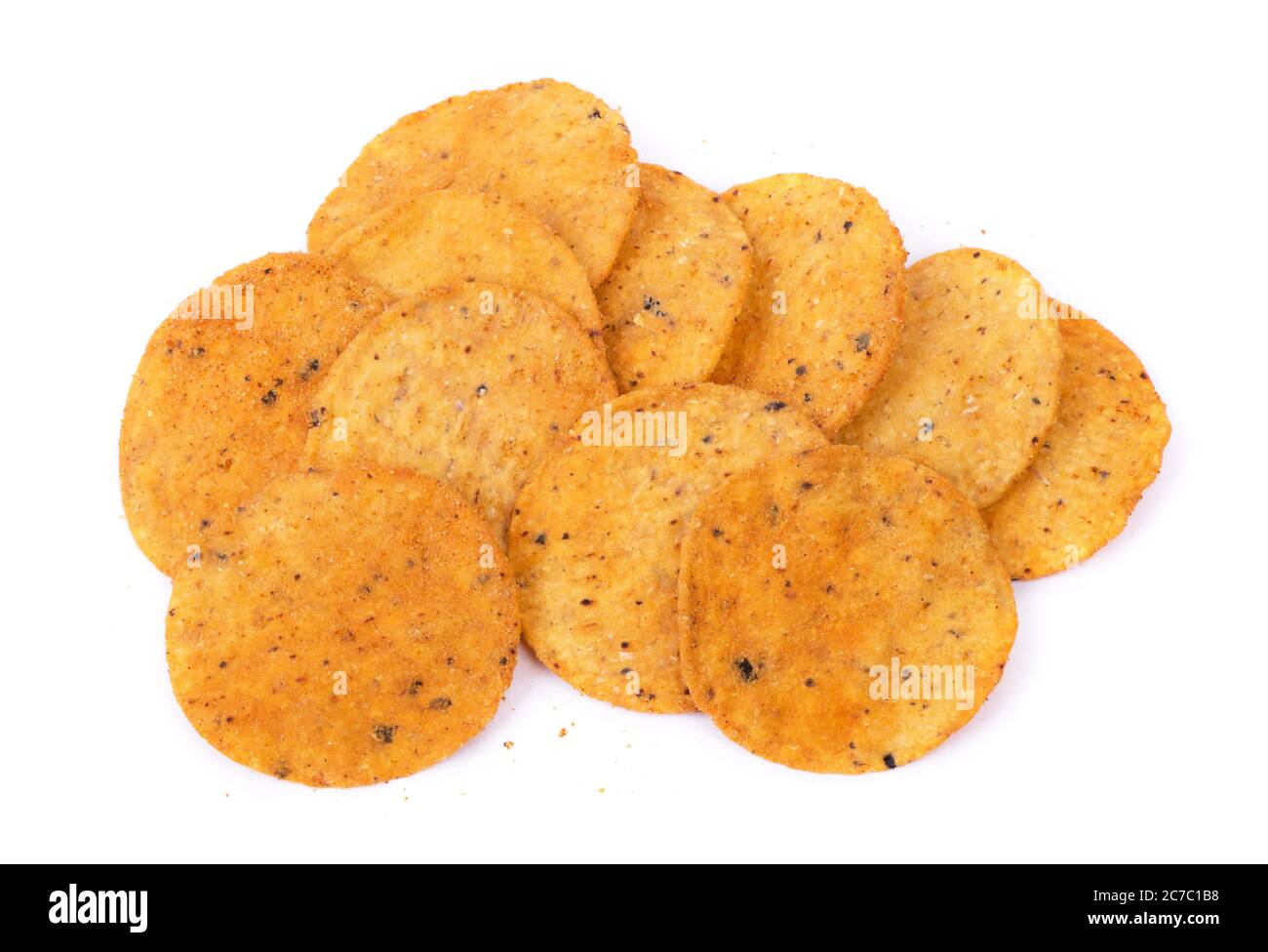Heap of round nachos isolated on white background Stock Photo - Alamy