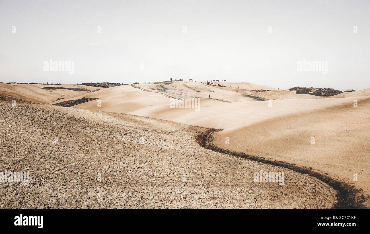 A wide shot of a pathway in a desert leading to the city under the ...