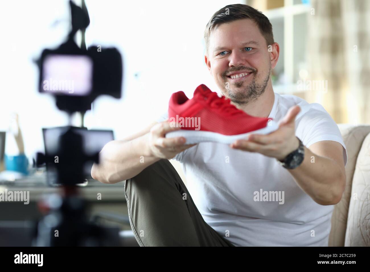 Happy guy present stylish shoes Stock Photo - Alamy
