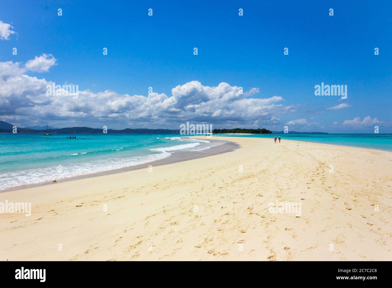 View of coastline of Iranja Island (Nosy Iranja) lined with palm trees ...