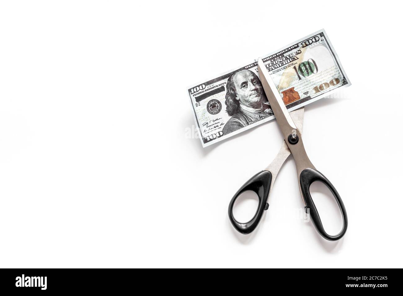 Cutting of US dollar banknote. Economic crisis concept Stock Photo - Alamy