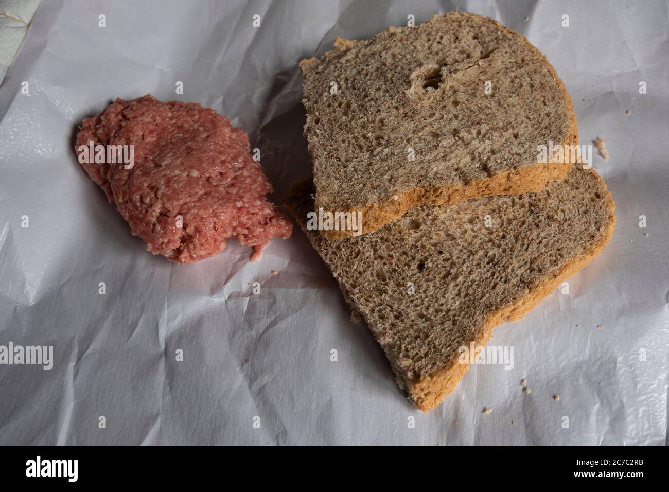 Typical Flemish quick bite, raw minced meat with brown bread Stock ...