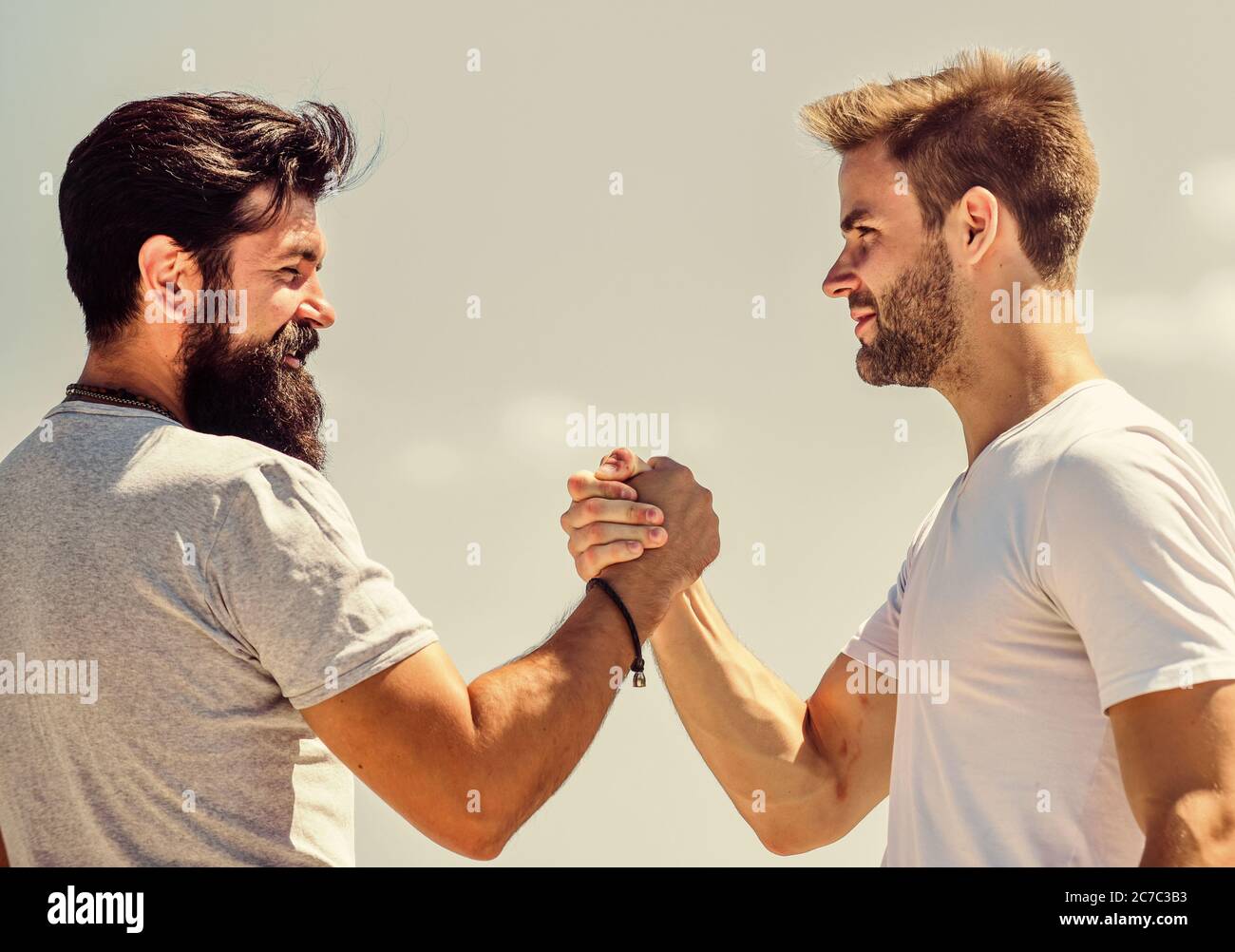 Handshake arm wrestling style. Strong and muscular arms. Successful ...