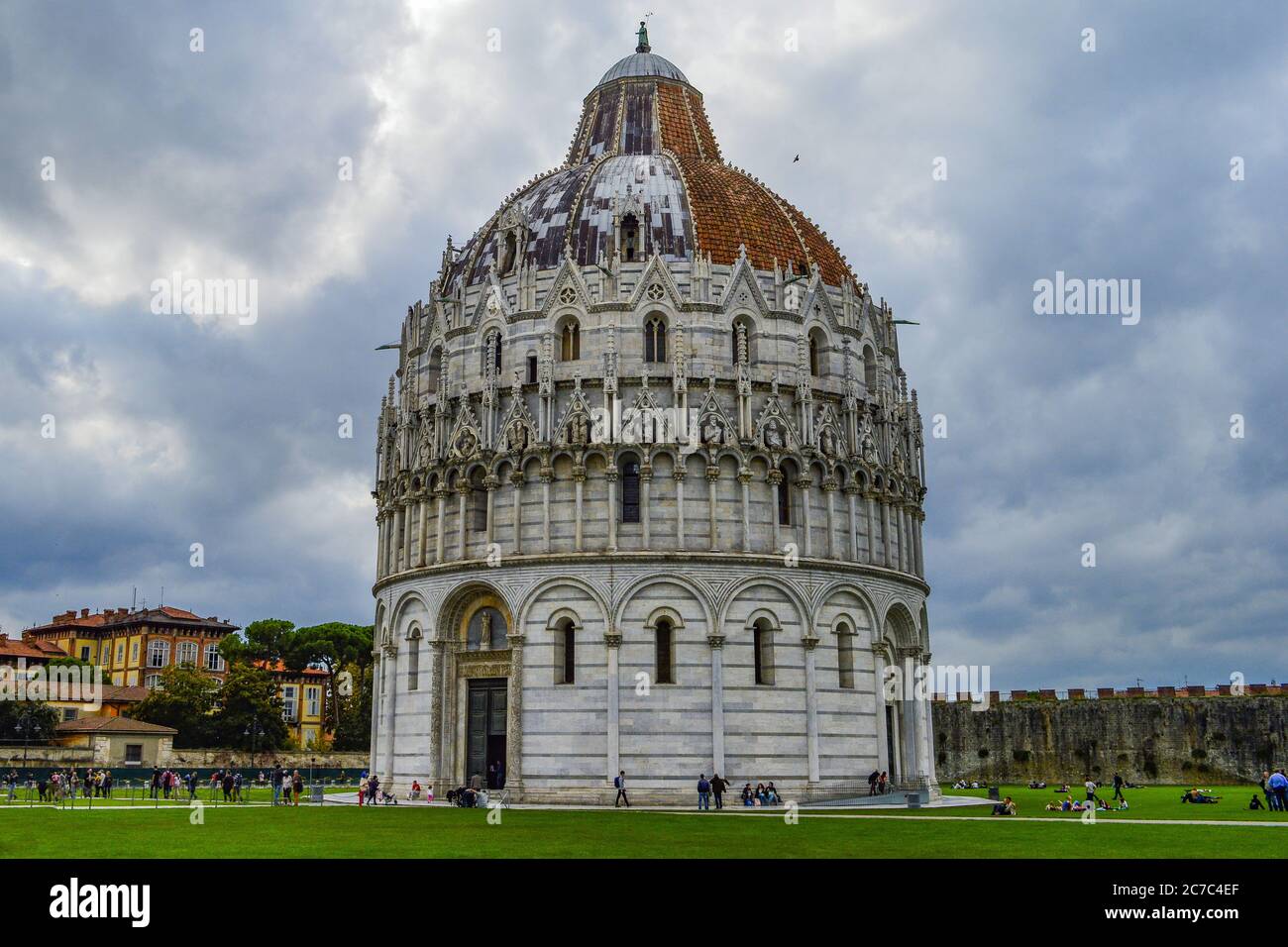 Horizontal shot of a round gothic building with segmented red roof ...