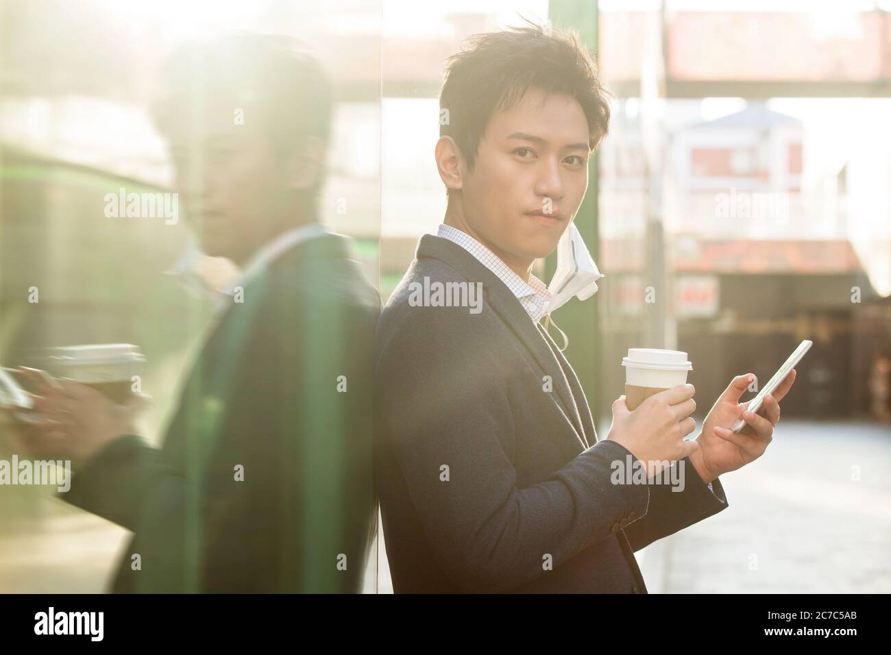 The young man the use of mobile phones Stock Photo - Alamy