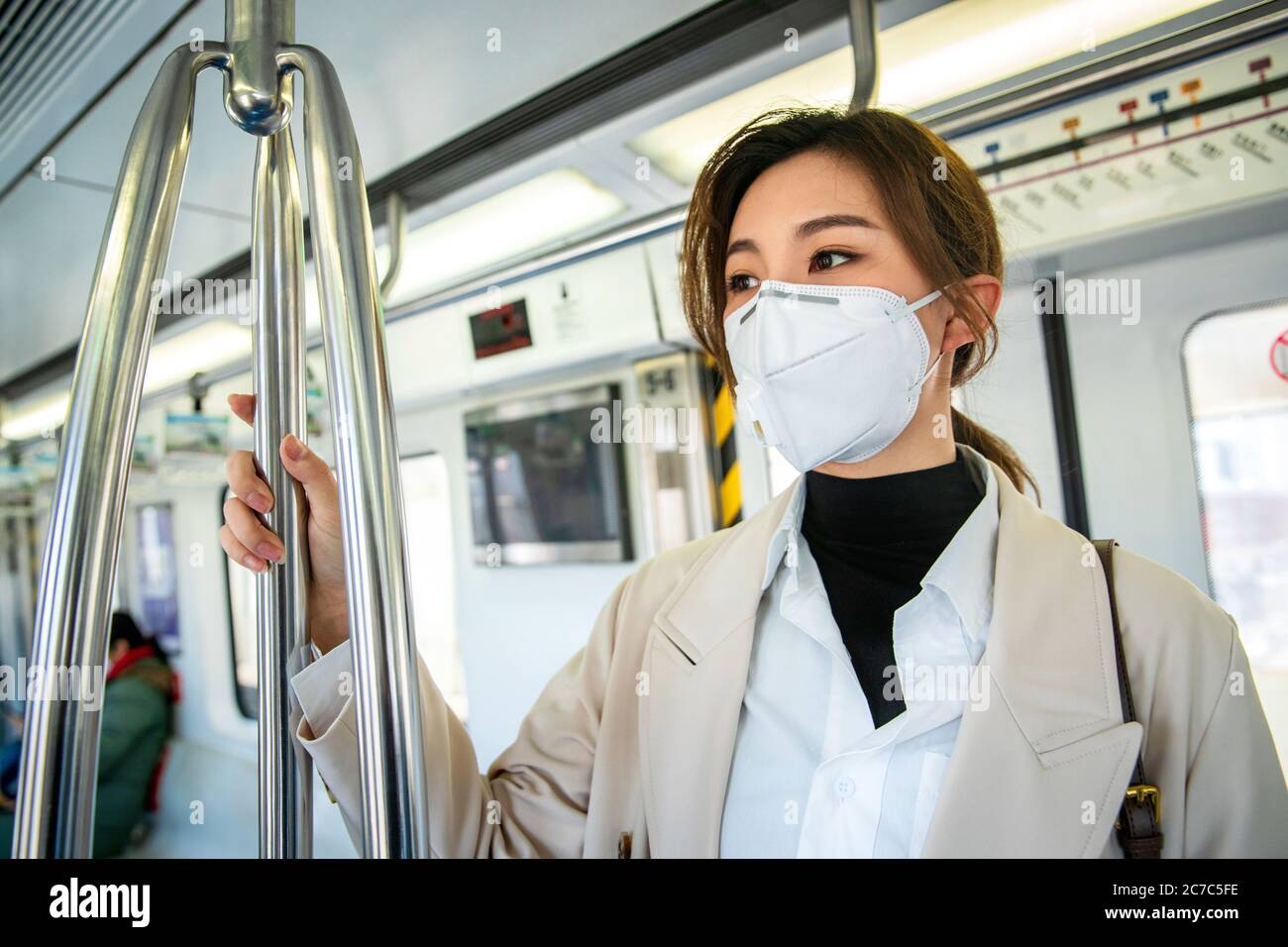 Young women take the subway Stock Photo - Alamy
