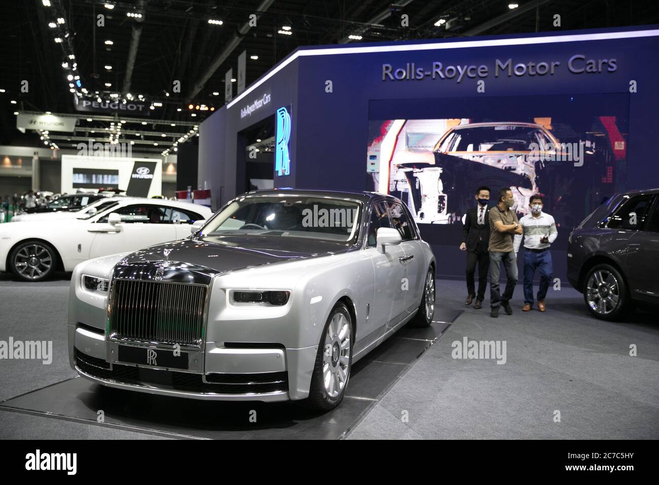 Bangkok, Thailand. 16th July, 2020. A salesman introduce a Rolls-Royce motor car to guests at ...