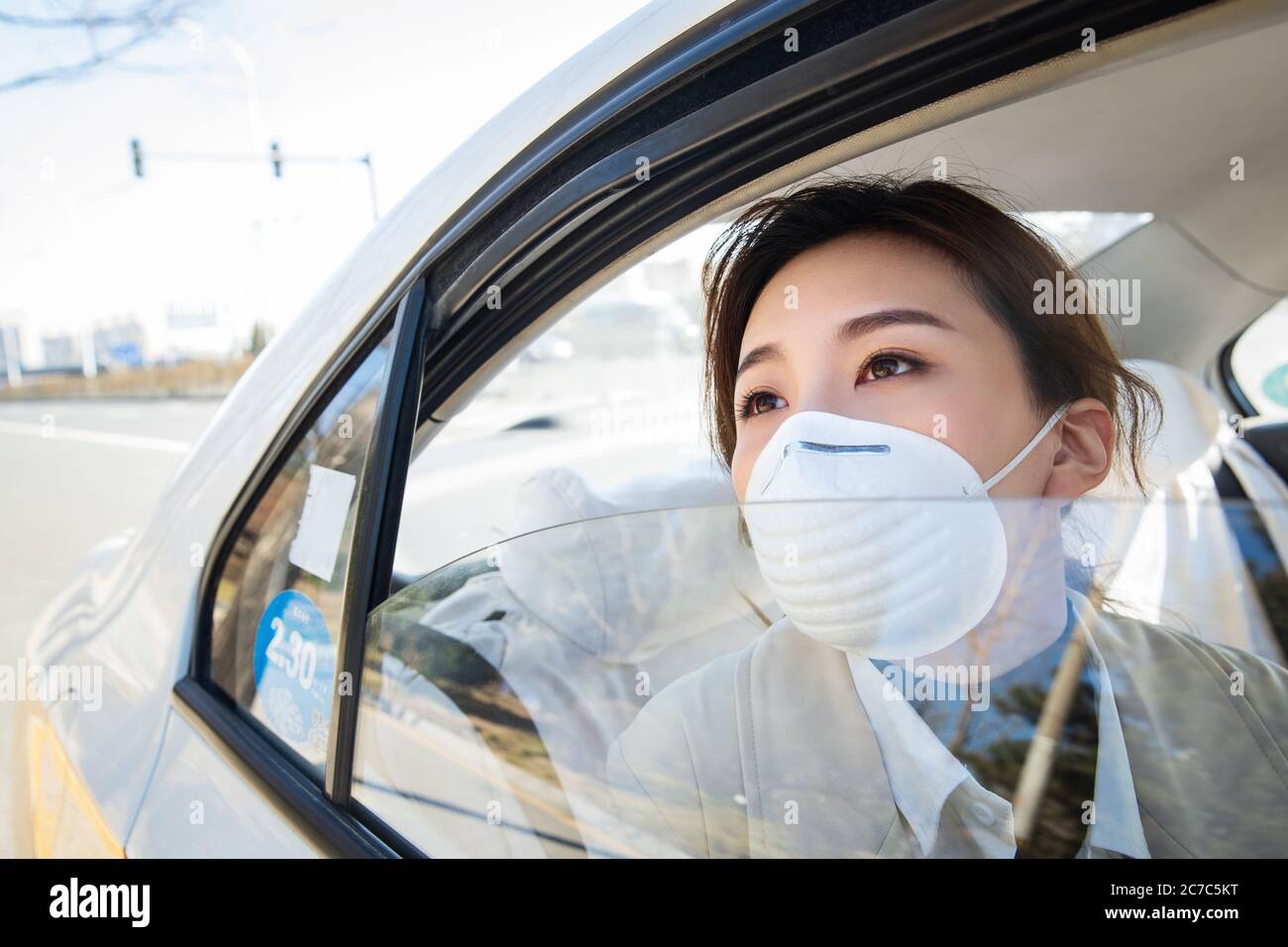 The young woman wearing a mask by car Stock Photo - Alamy