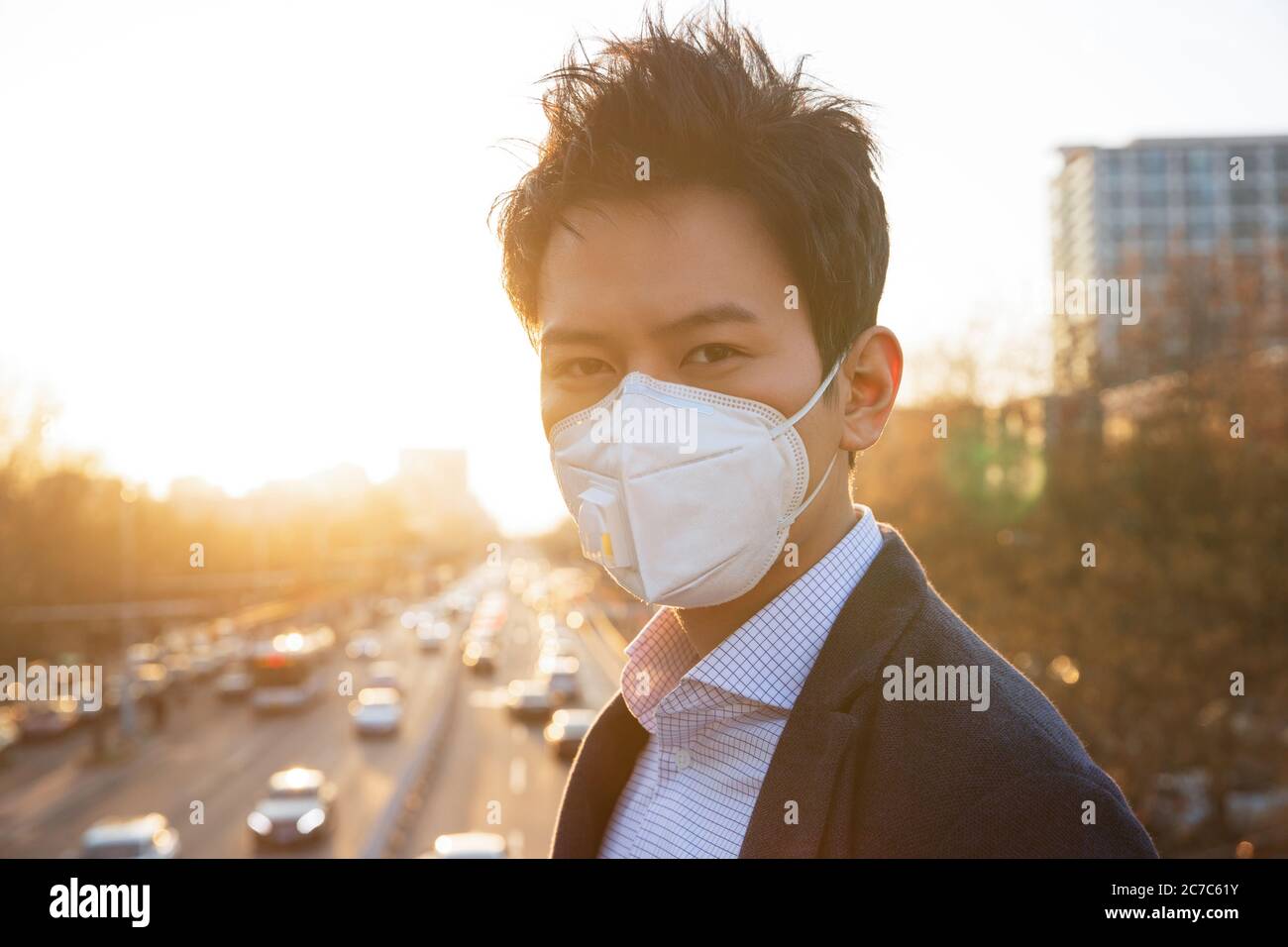 Outdoor wearing a mask of the young man Stock Photo - Alamy