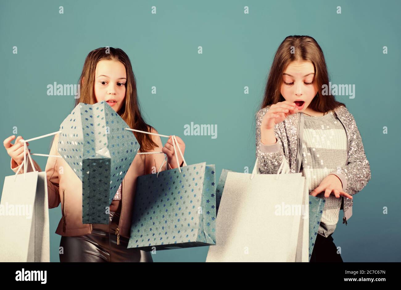 Shopping day happiness. Sisters shopping together. Buy clothes ...