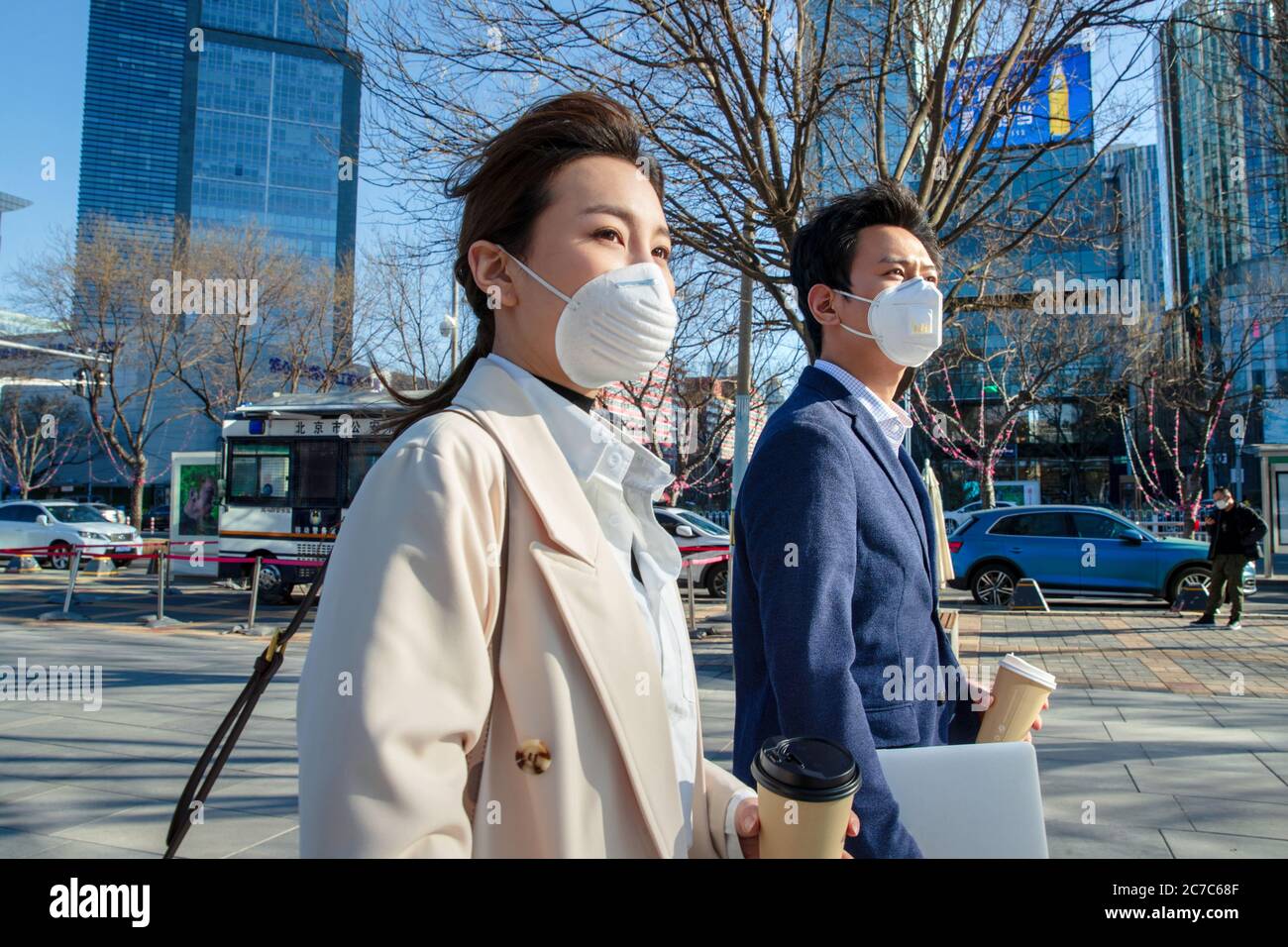 Wearing a mask of business people Stock Photo - Alamy