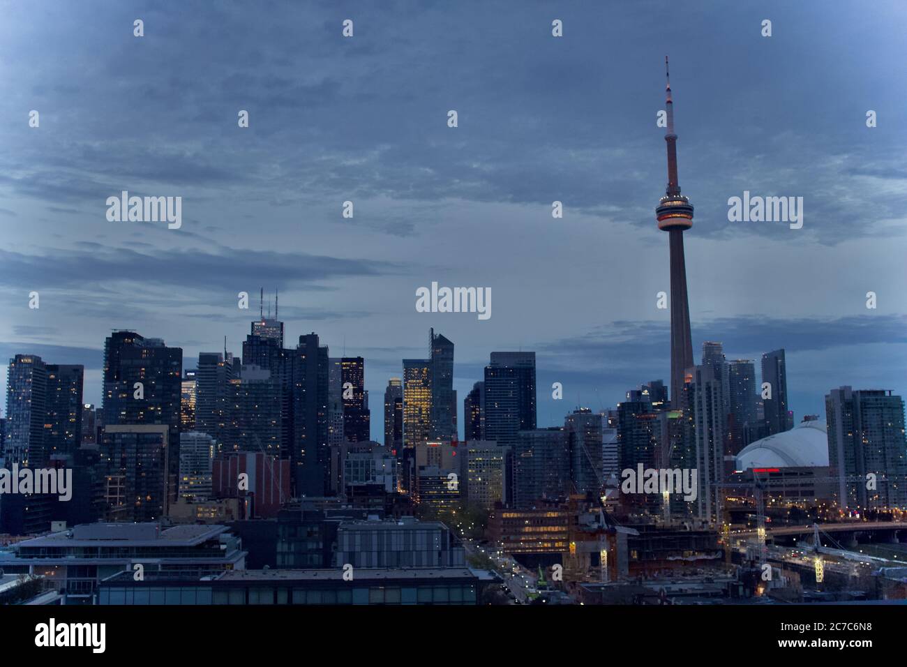 Wide landscape shot of a city with skyscrapers and a tall tower on the ...