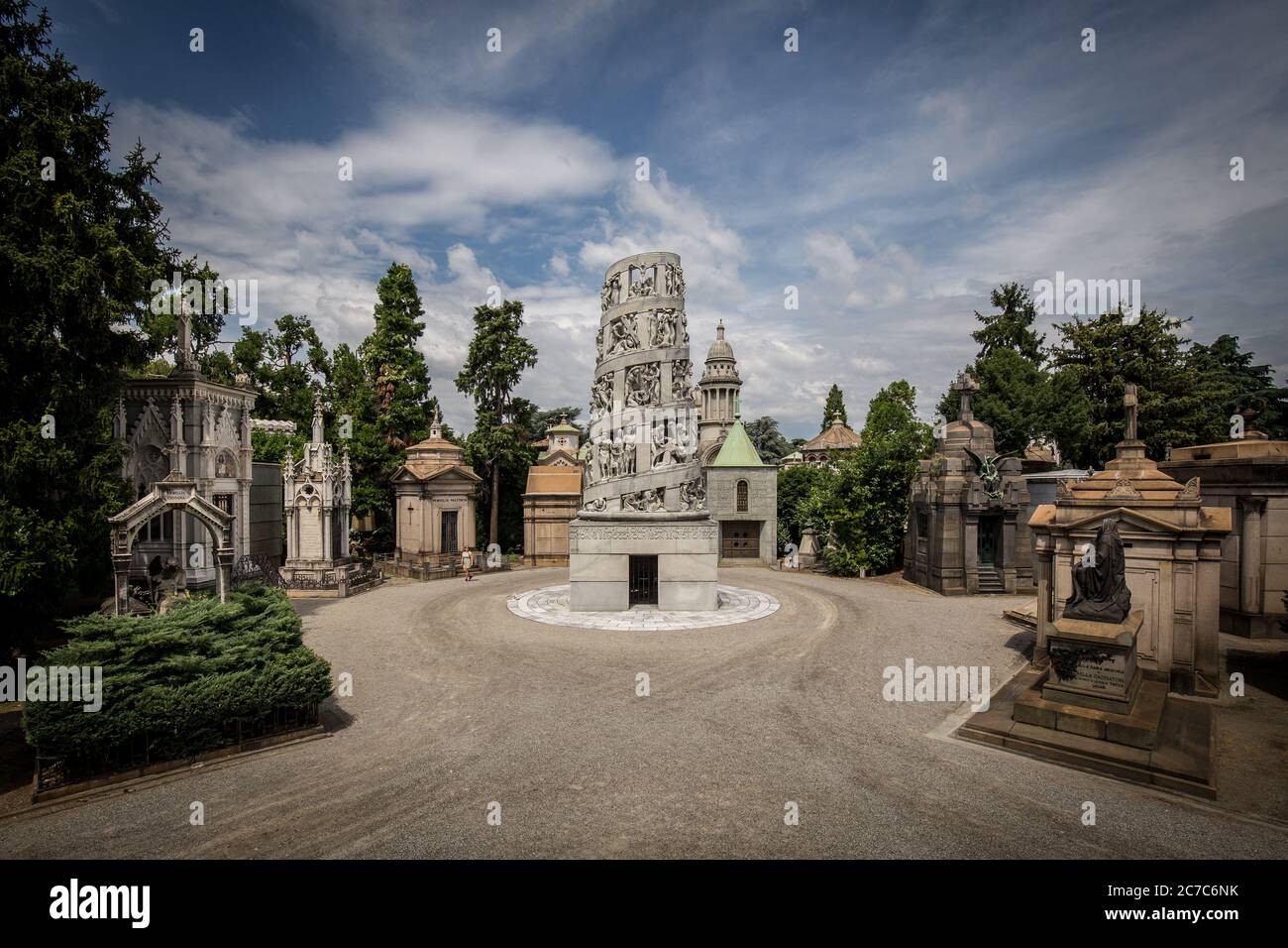 Horizontal shot of Christian tombs aligned in a circle with a stone ...
