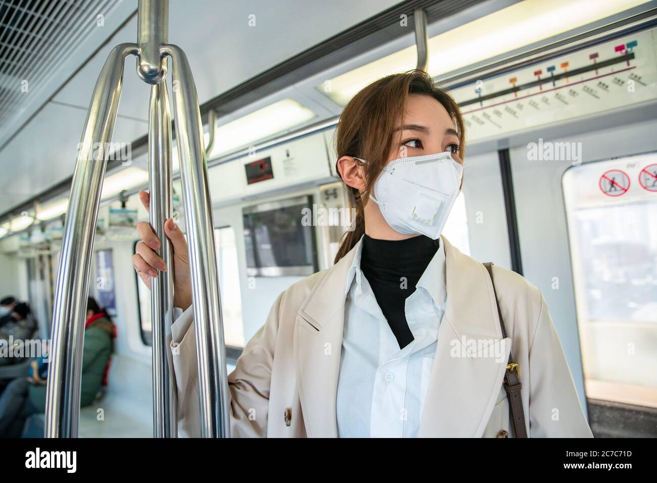 Young women take the subway Stock Photo - Alamy