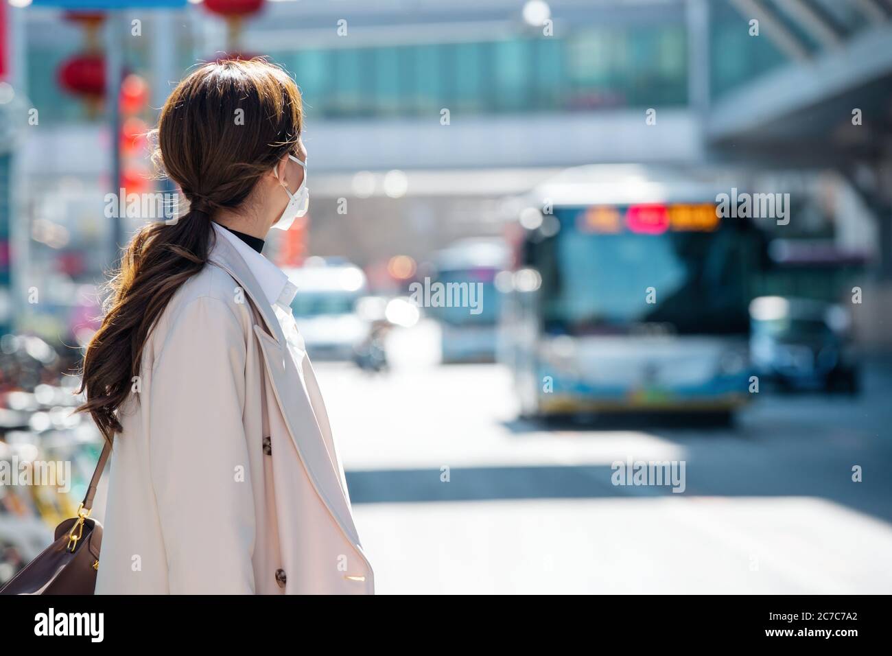 Young woman wearing a mask in the outdoor walk Stock Photo - Alamy