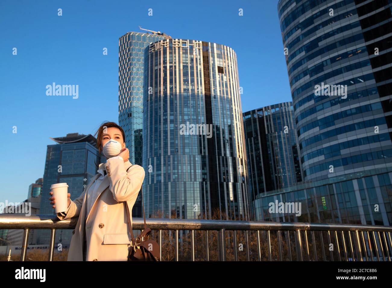 Outdoor wearing a mask of the young woman Stock Photo - Alamy