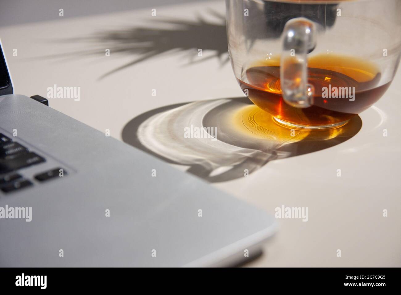 Light office desk table with laptop and cup of tea Stock Photo - Alamy