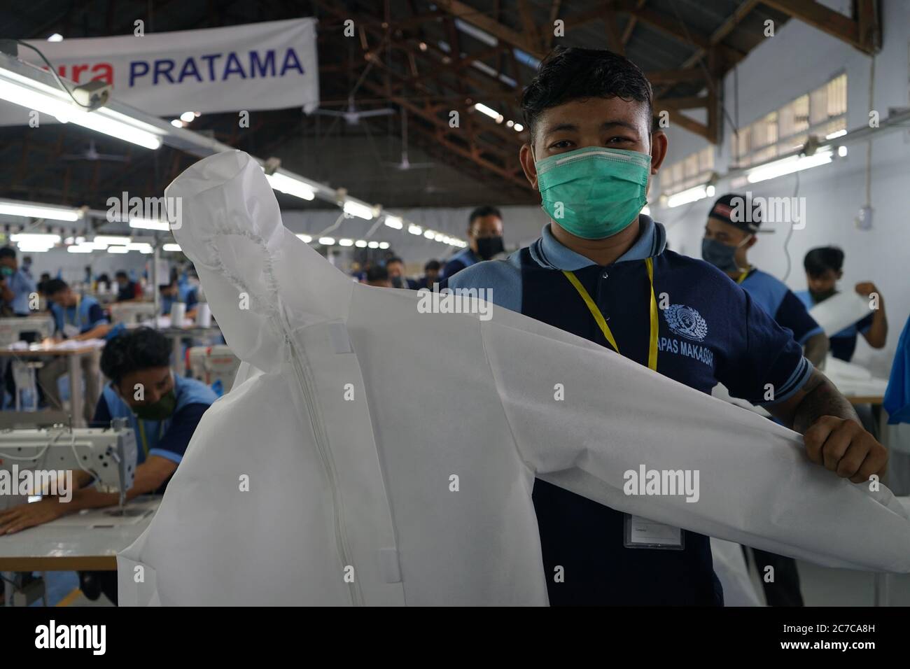 Makassar, Indonesia. 16th July, 2020. A prisoner shows hazmat clothes ...