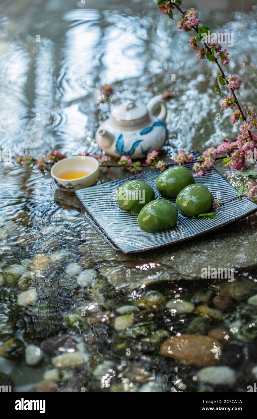 Green group and floating on the surface of the tea set Stock Photo - Alamy