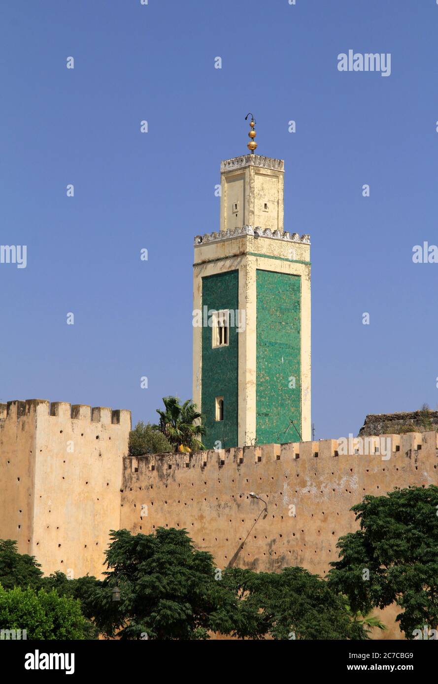 Morocco, Meknes, Historical city wall and mosque minaret in Arabesque ...