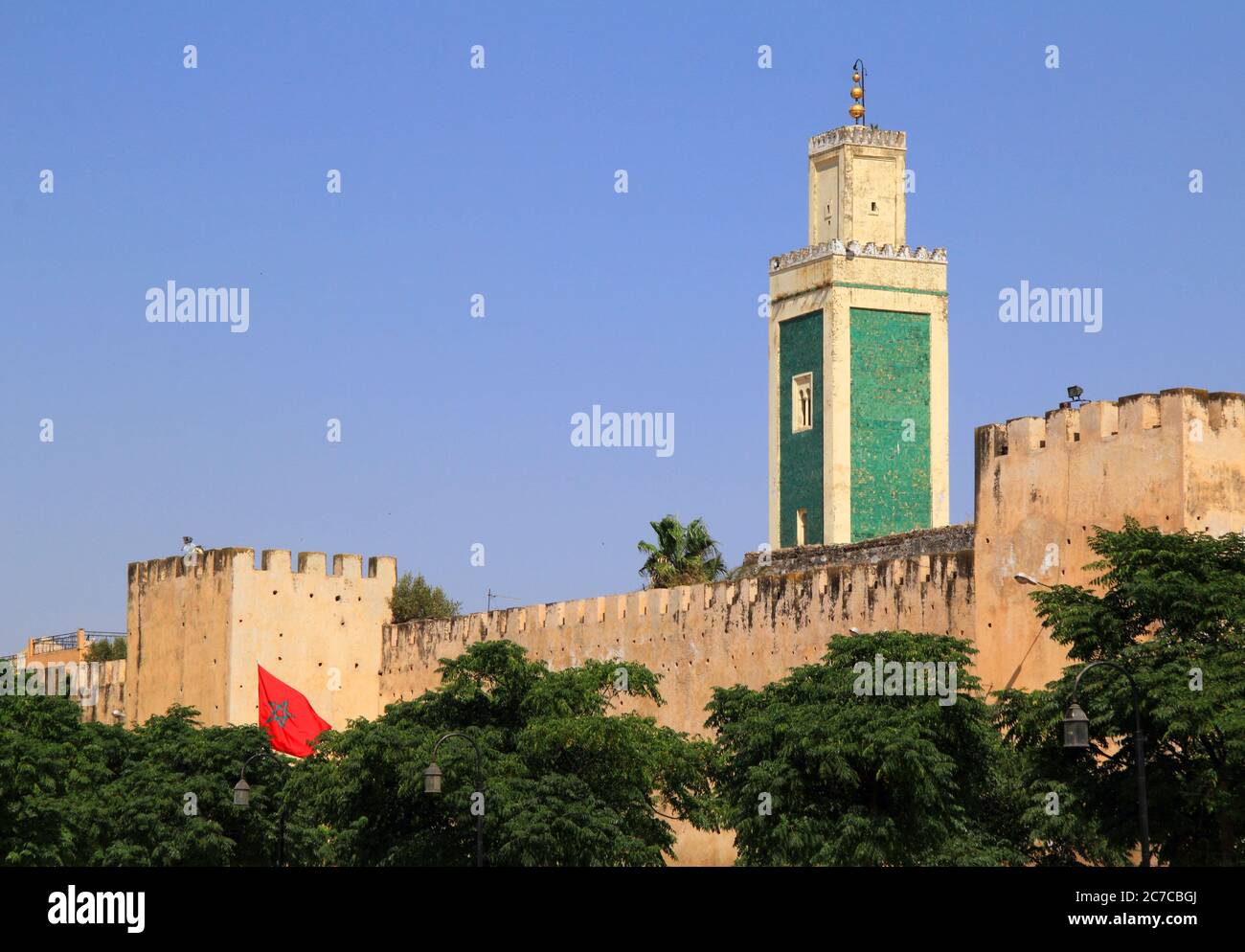 Morocco, Meknes, Historical city wall and mosque minaret in Arabesque ...