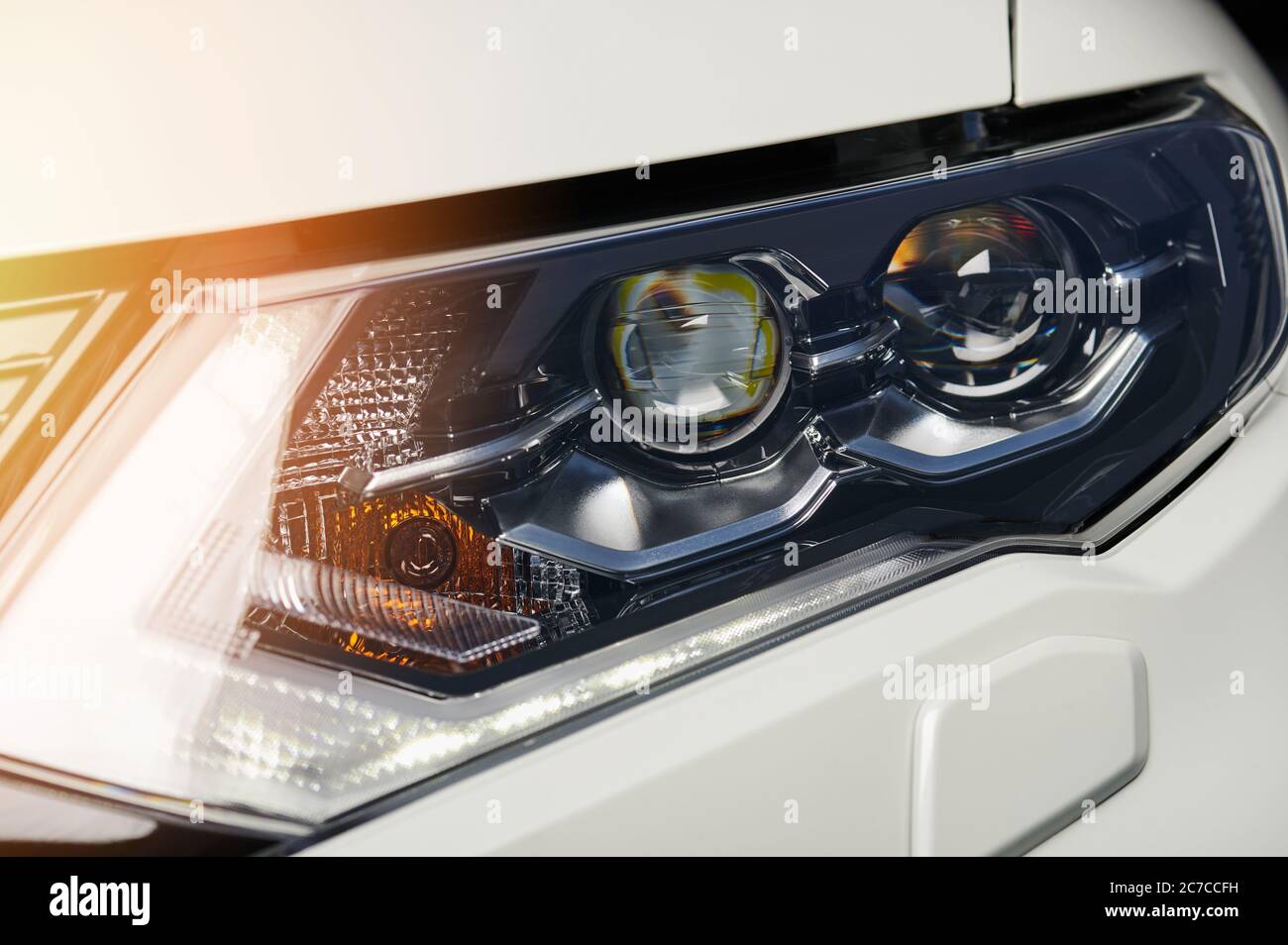 Front lights in modern white car close up view Stock Photo - Alamy