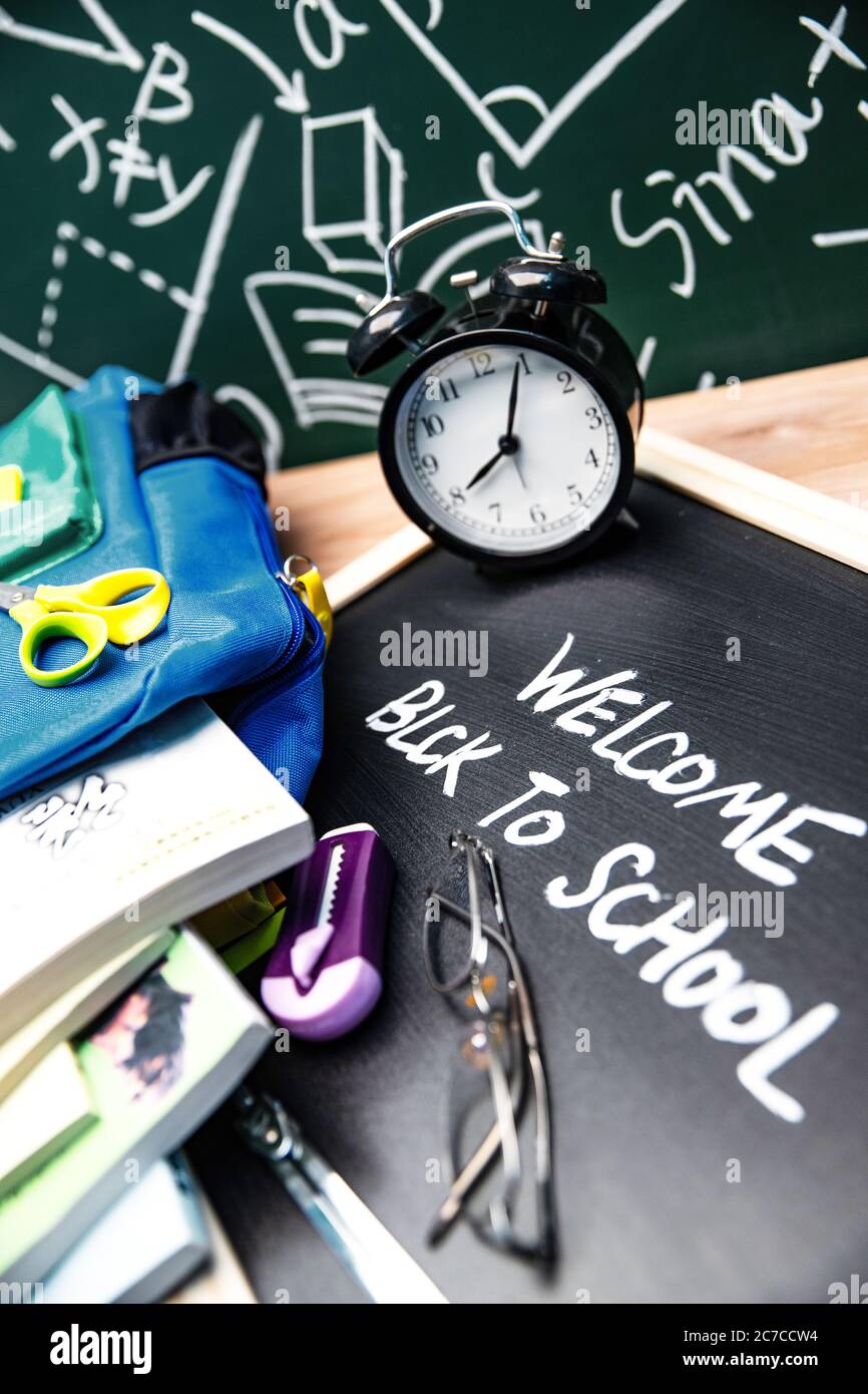 The blackboard drawing and an alarm clock Stock Photo - Alamy