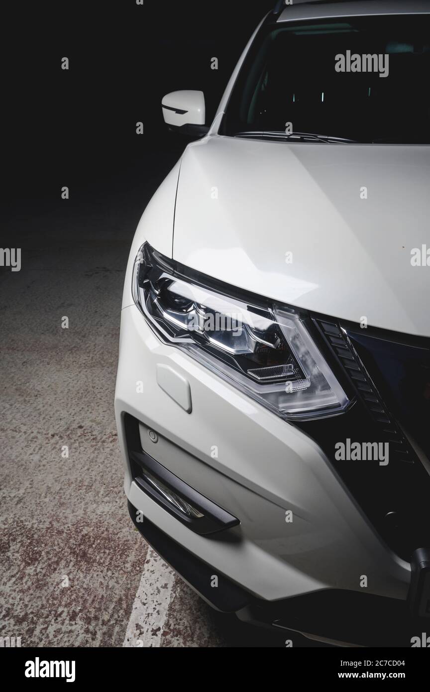 Front view of white modern SUV car on black background Stock Photo - Alamy