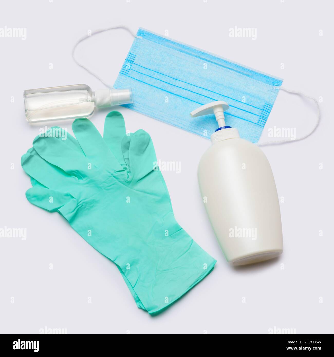 flat layout of hygiene items - latex gloves, mask and hand sanitizer ...