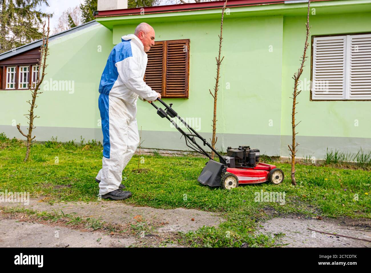 Cutting grass manually hi-res stock photography and images - Alamy