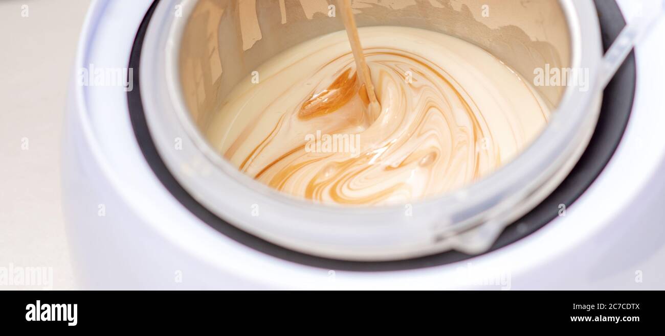 Electric wax warmer or wax heater with melted wax during heating inside ...