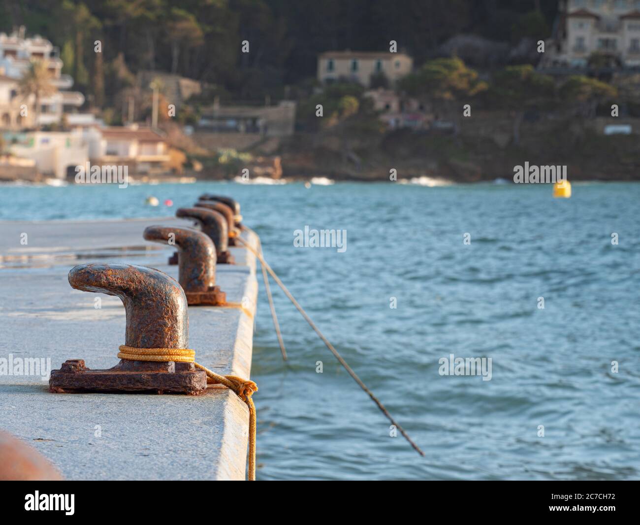 Mooring pin for medium size boat. Rusty bent mooring bollard in a port ...
