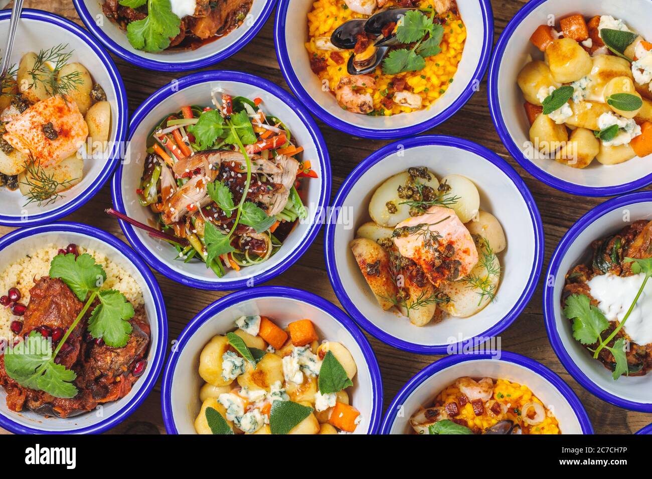 Overhead shot of different types of dishes in bowls near each other on ...