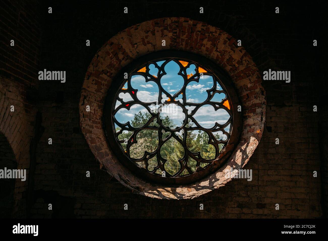 Round stained glass window in old abandoned castle Stock Photo - Alamy