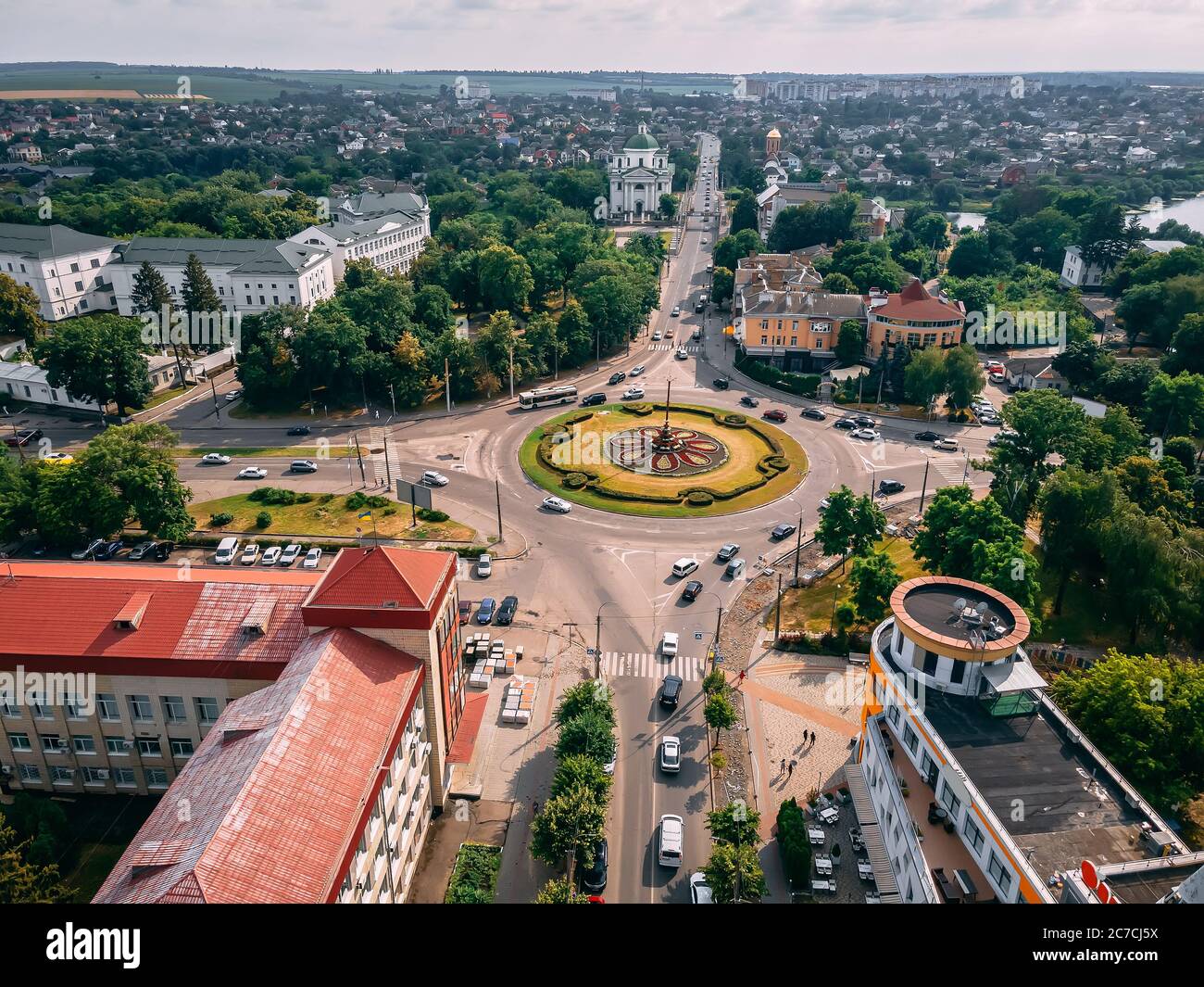 Aerial view of roundabout road with circular cars in small european ...