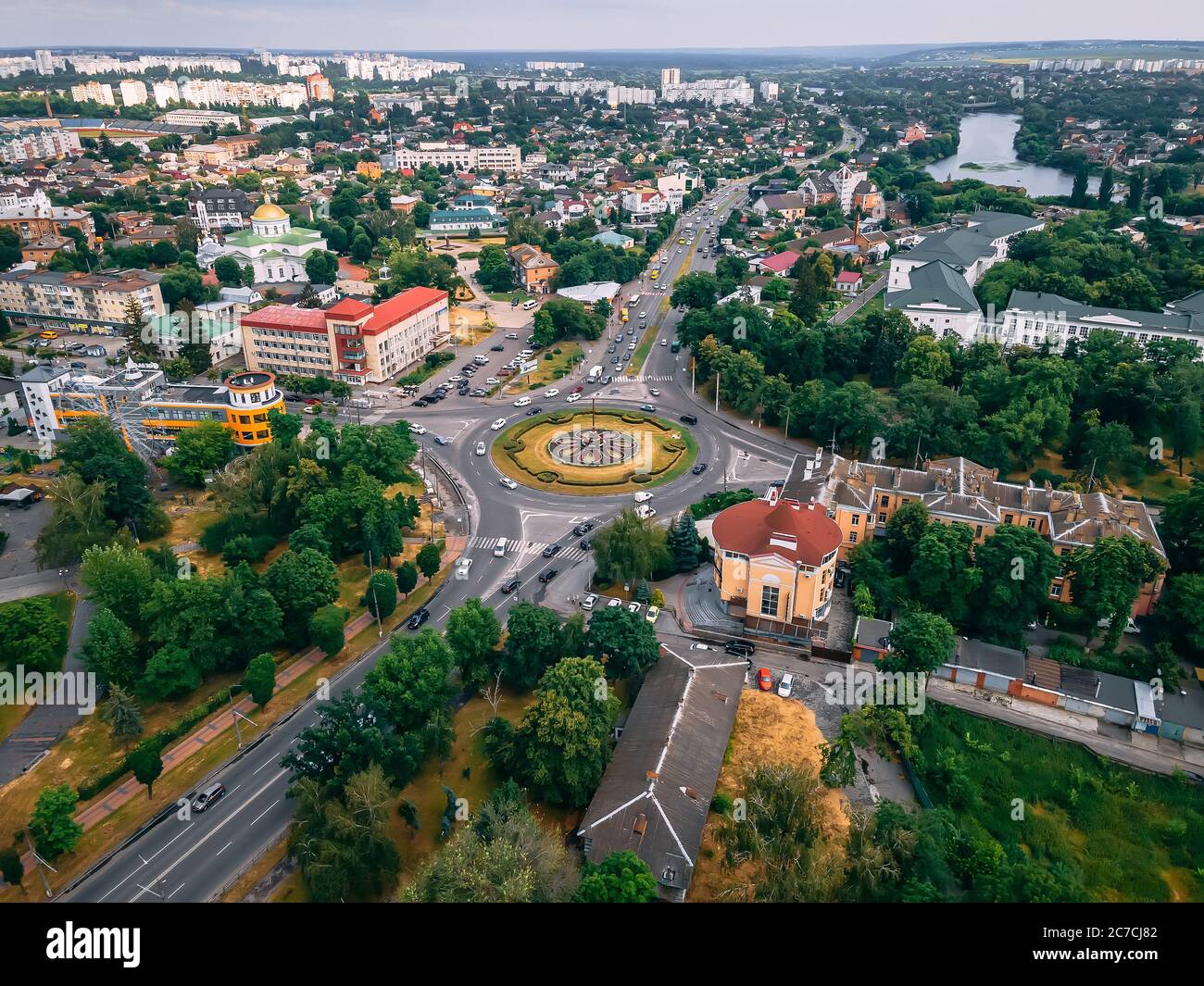 Aerial view of roundabout road with circular cars in small european ...