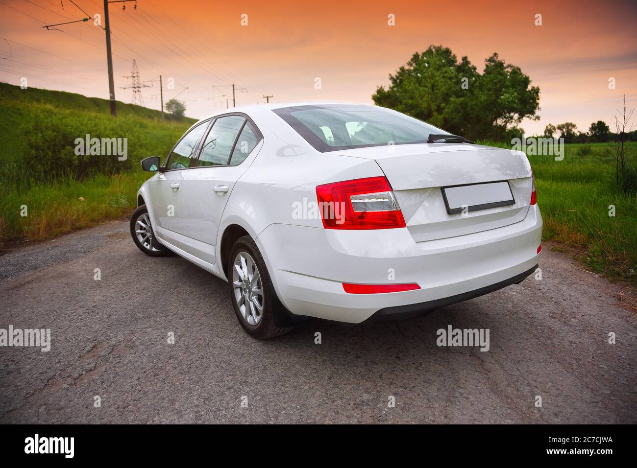 Rear-side view of a car on nature background Stock Photo - Alamy
