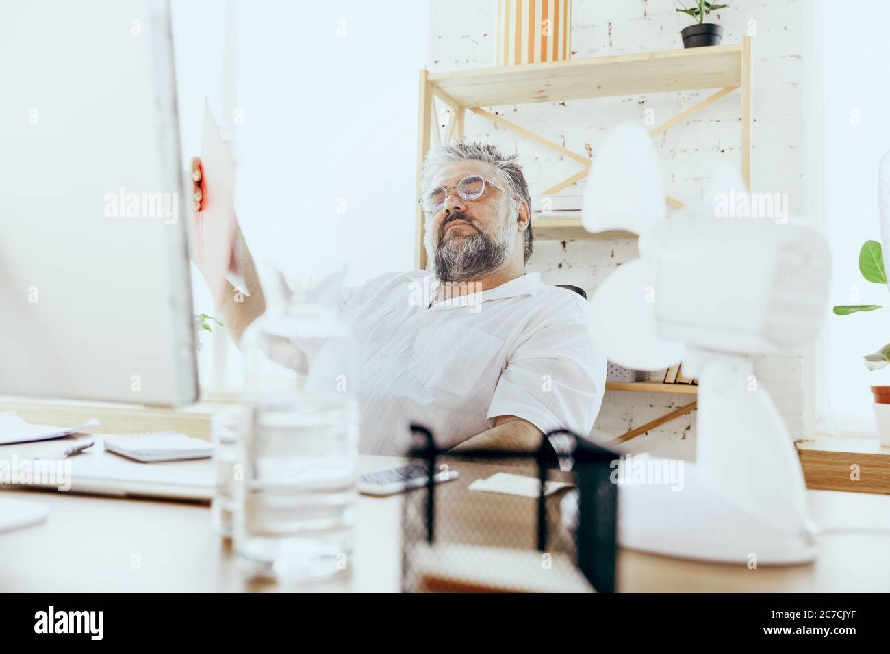 Sweating office hi-res stock photography and images - Alamy