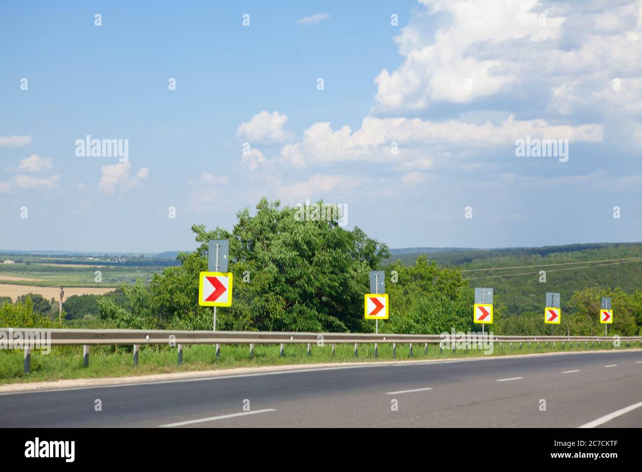Road Signs of Dangerous Turning Direction Stock Photo - Alamy