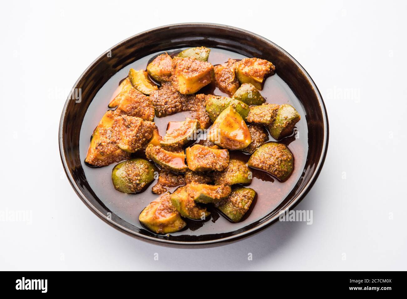Homemade Mango Pickle or Aam ka Achar in a bowl, selective focus Stock ...