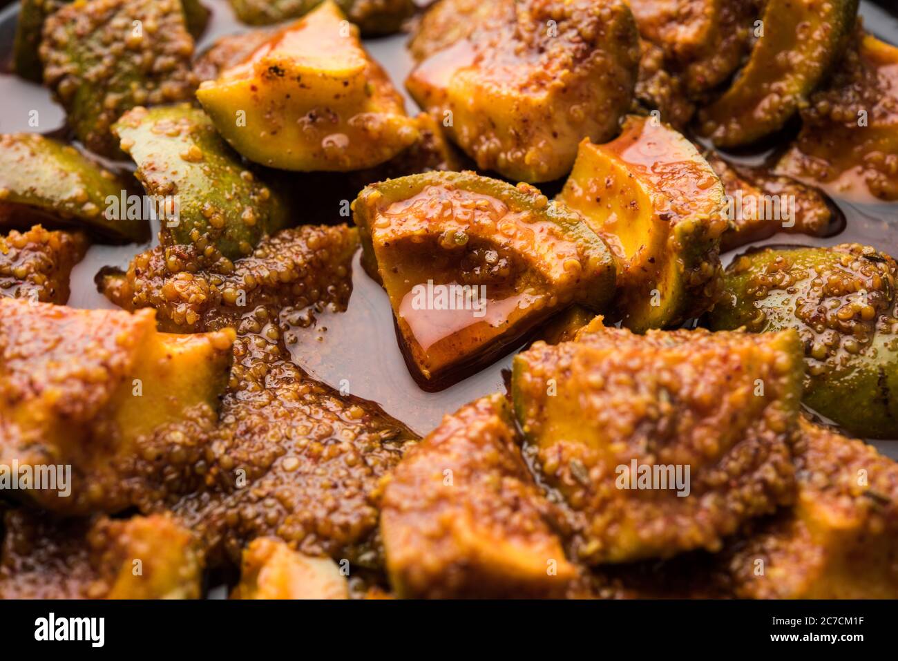 Homemade Mango Pickle or Aam ka Achar in a bowl, selective focus Stock ...