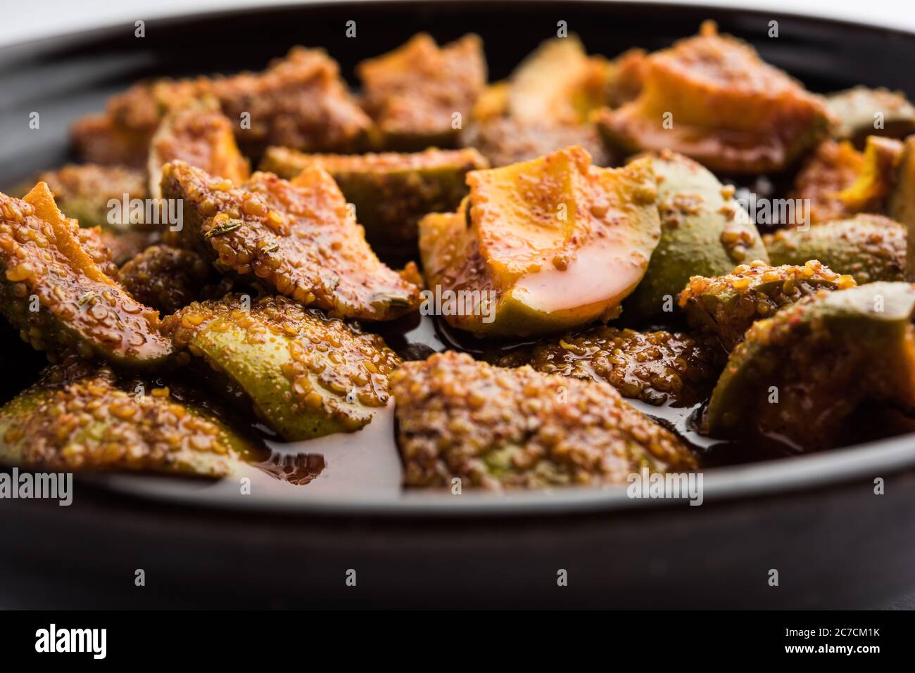 Homemade Mango Pickle or Aam ka Achar in a bowl, selective focus Stock ...