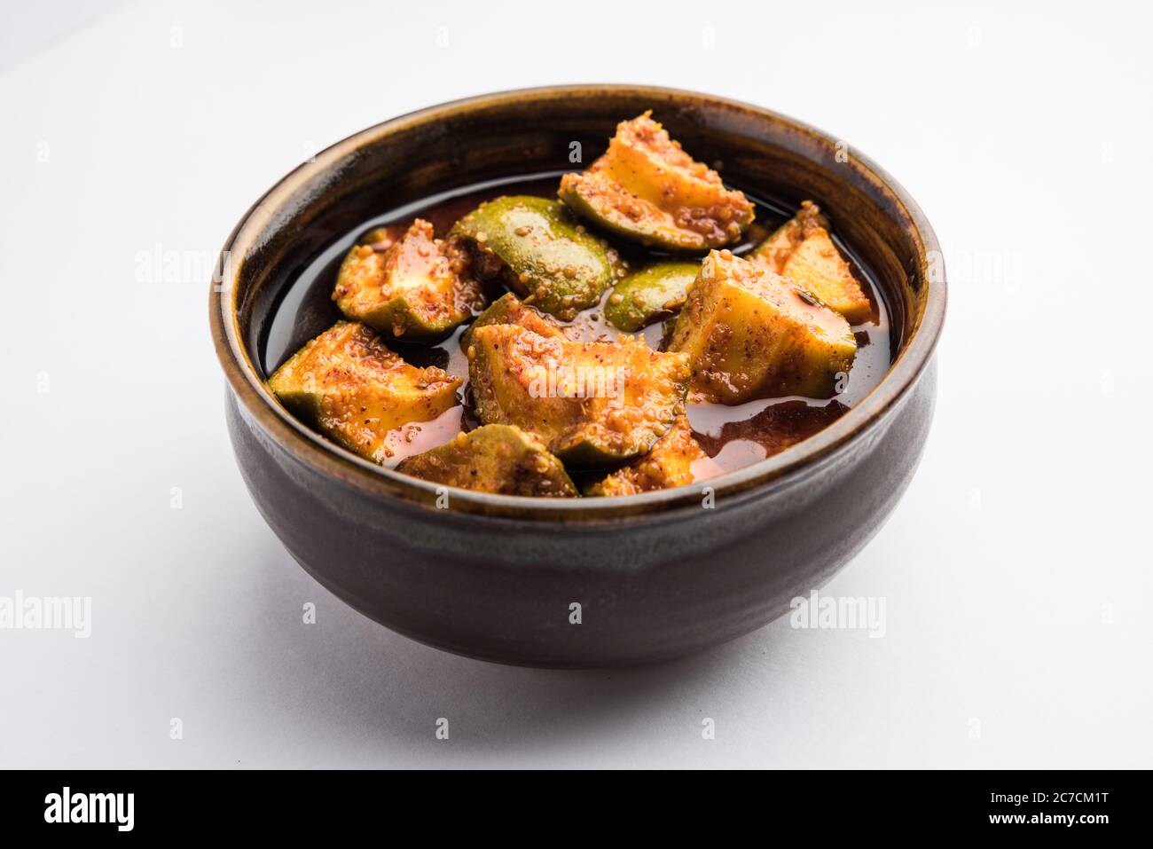 Homemade Mango Pickle or Aam ka Achar in a bowl, selective focus Stock ...