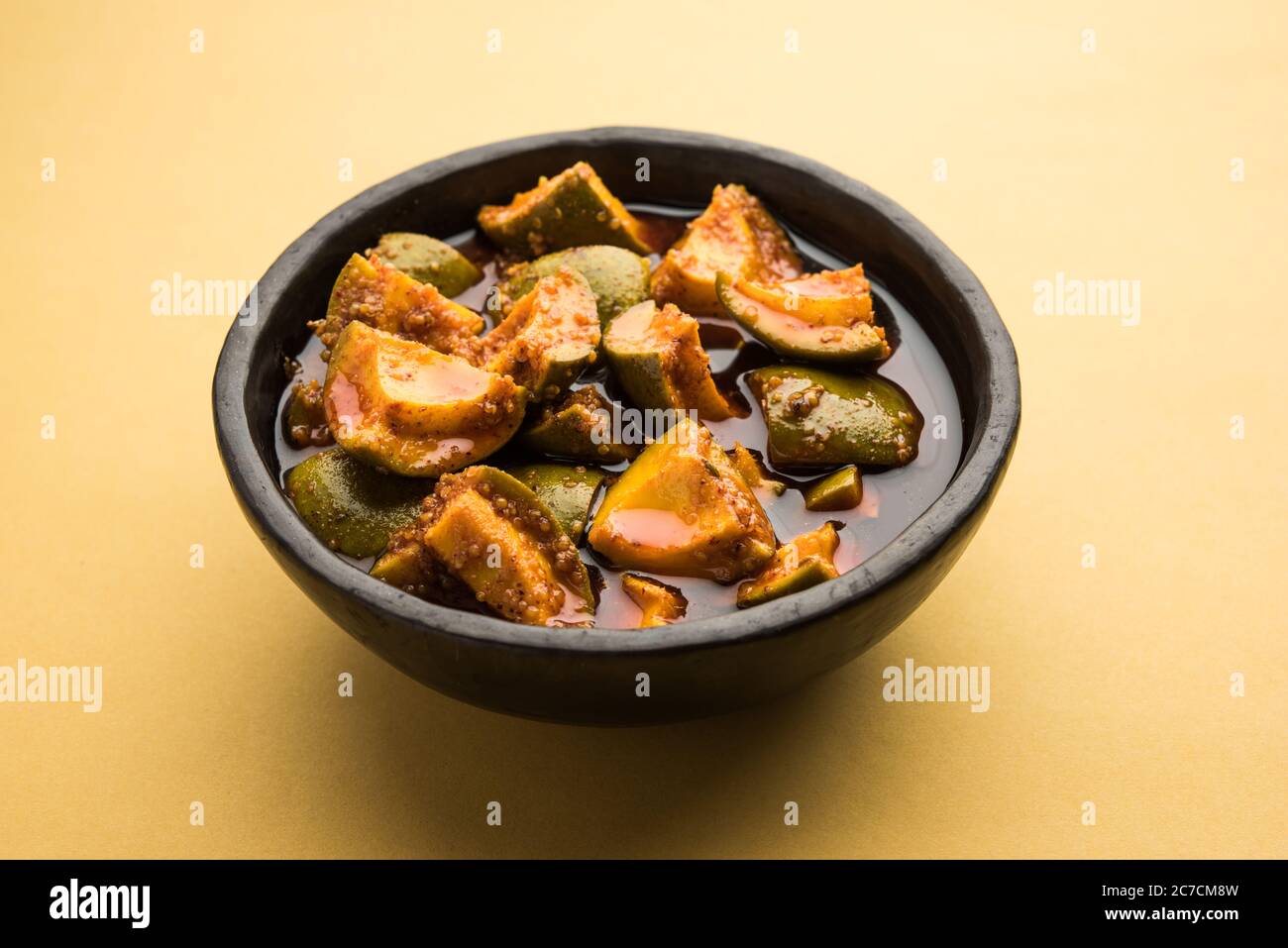 Homemade Mango Pickle or Aam ka Achar in a bowl, selective focus Stock ...